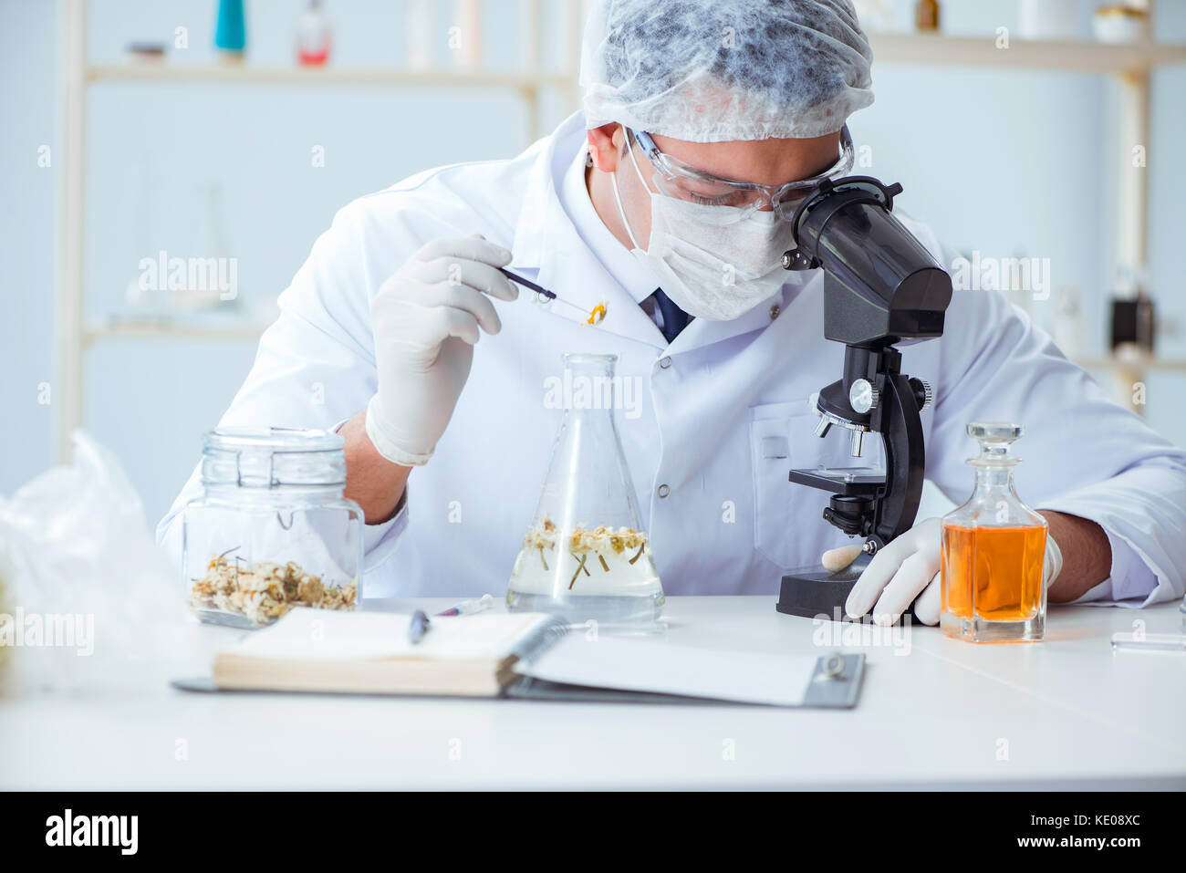 Chemist mixing perfumes in the lab Stock Photo - Alamy