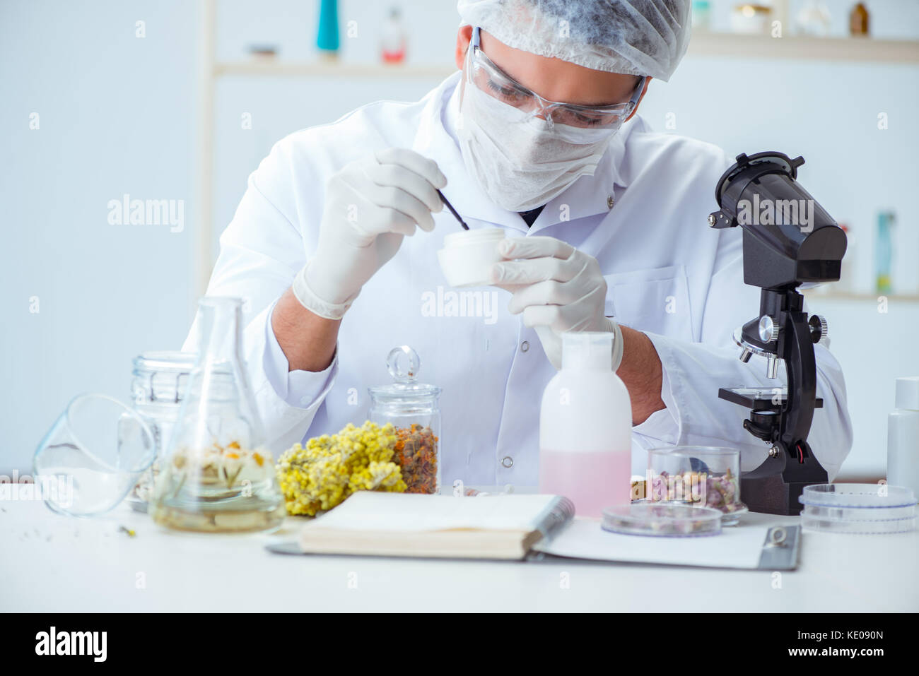 Chemist mixing perfumes in the lab hi-res stock photography and images ...