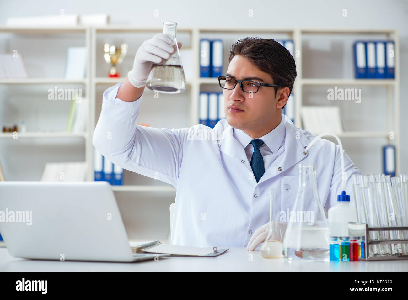 Young researcher scientist doing a water test contamination experiment ...