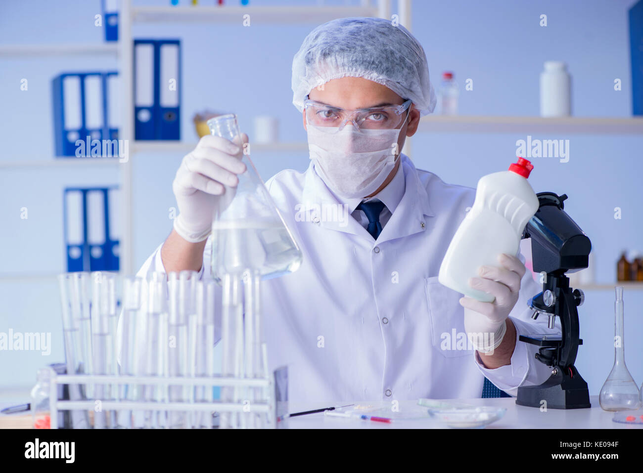Man in the lab testing new cleaning solution detergent Stock Photo - Alamy