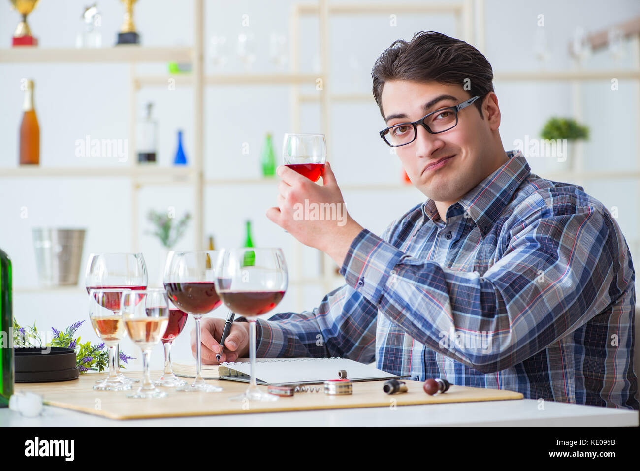 Professional sommelier tasting red wine Stock Photo - Alamy