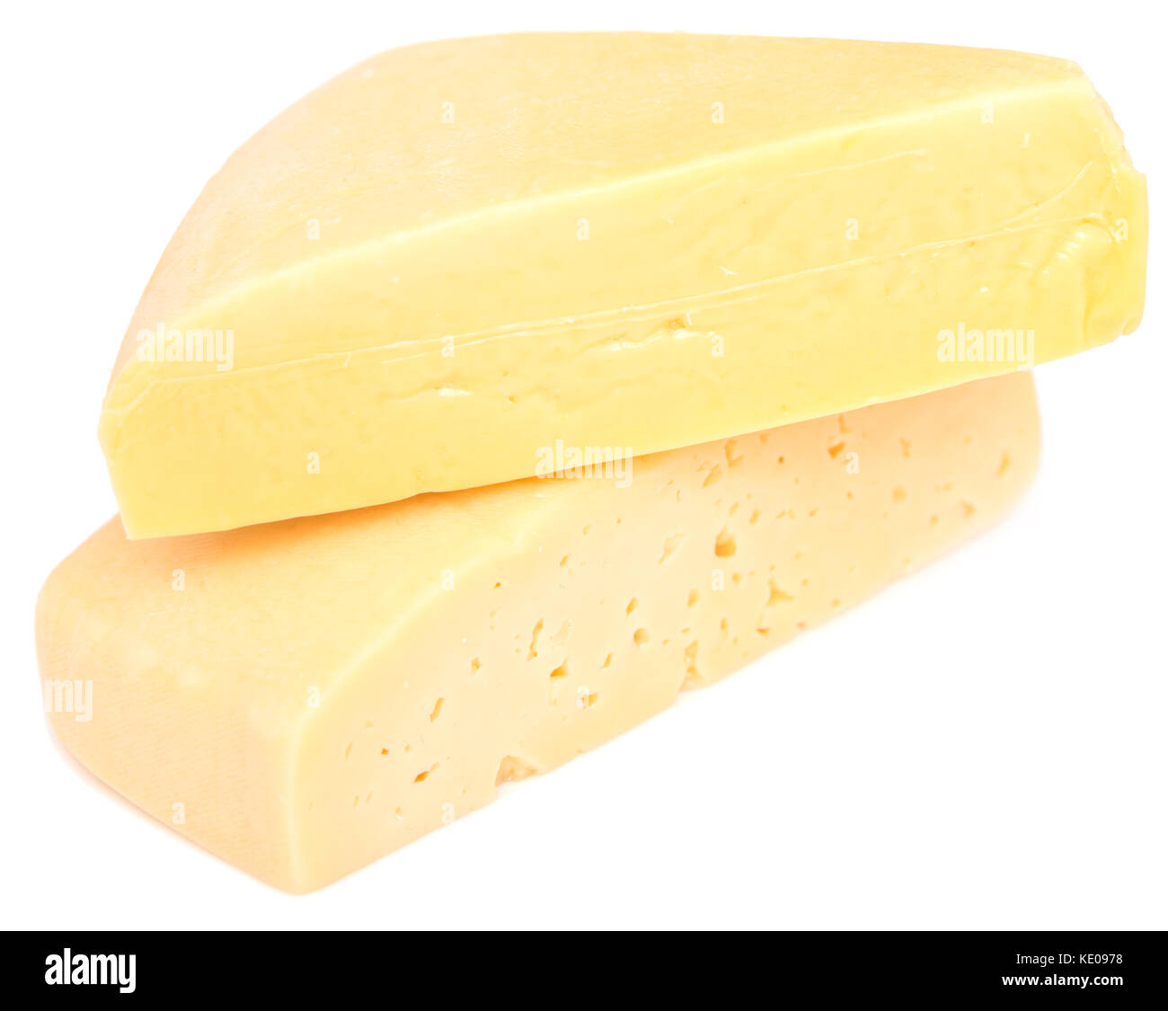 two pieces of cheese isolated on white Stock Photo - Alamy
