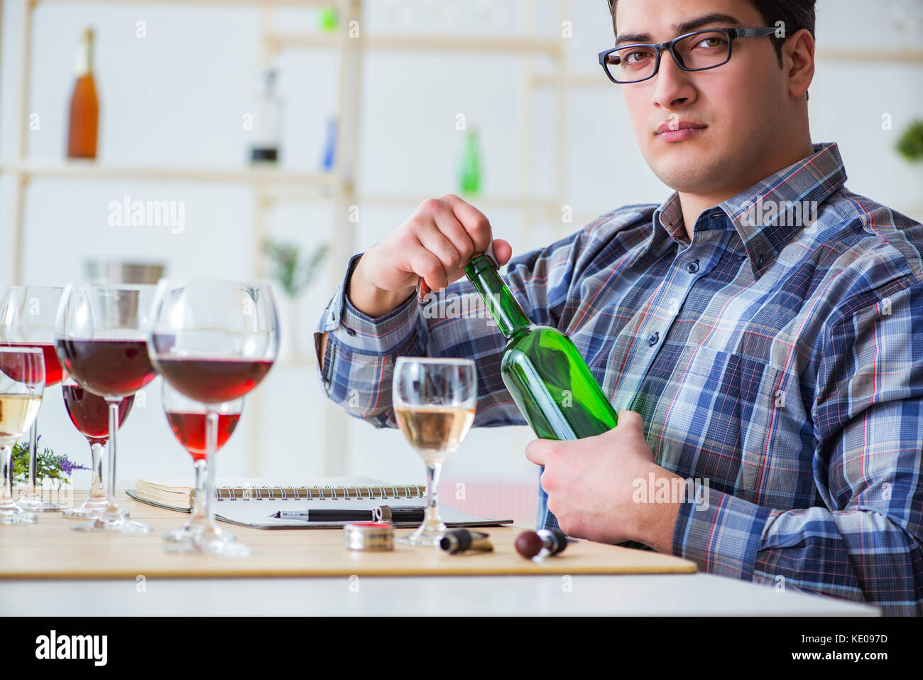 Professional sommelier tasting red wine Stock Photo - Alamy