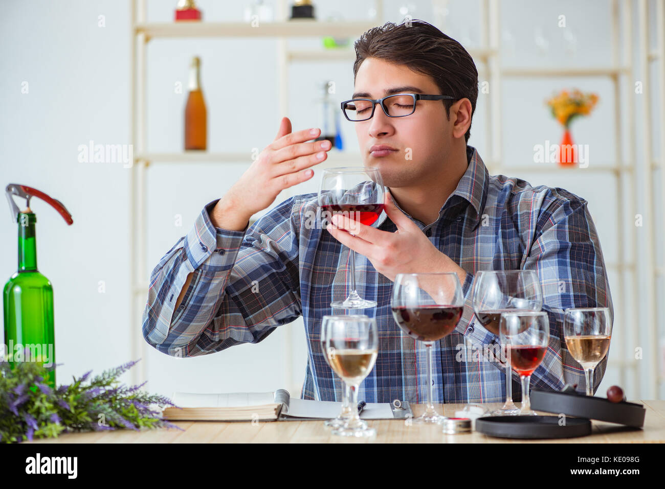 Professional sommelier tasting red wine Stock Photo - Alamy