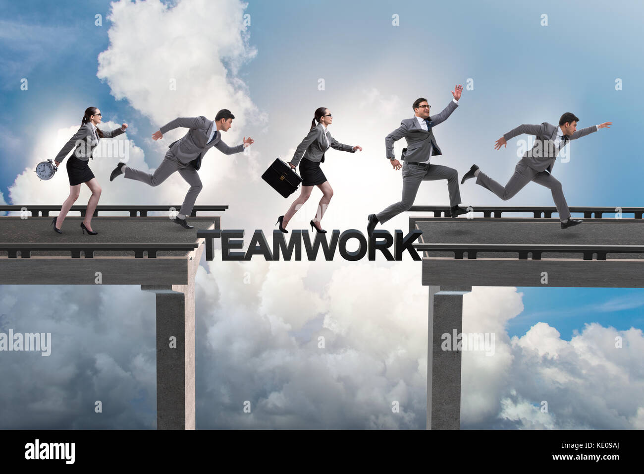 Teamwork concept with business people crossing bridge Stock Photo - Alamy