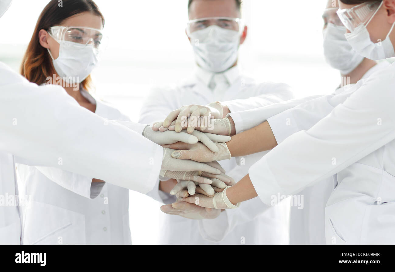 Close-up Photo Of Doctors Stacking Hand With Coworkers Stock Photo - Alamy