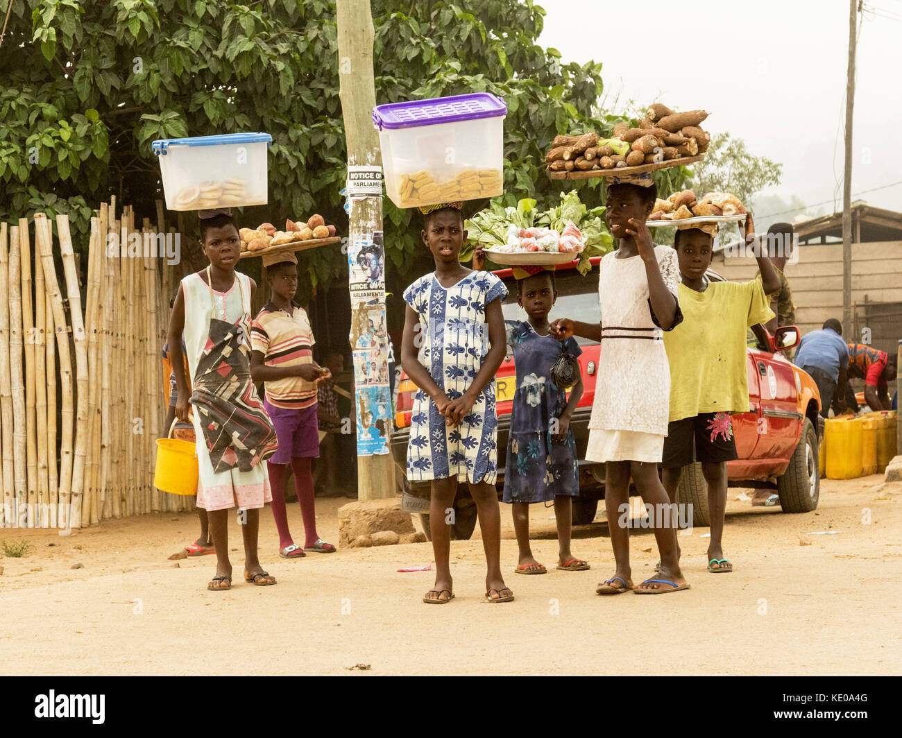 Accra, Ghana - December 28, 2016: girls wear overhead food to sell to ...