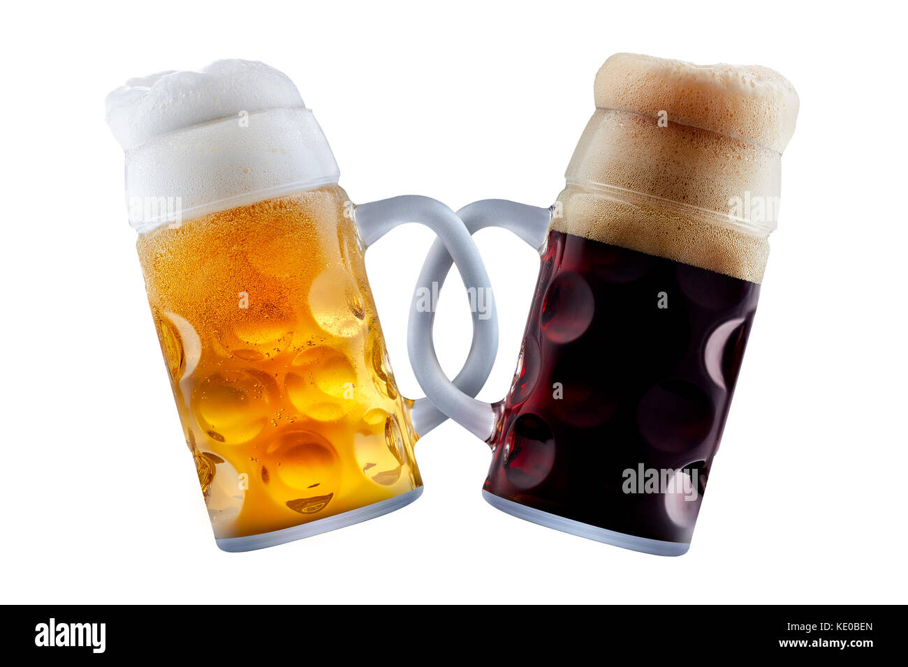 Two beer mugs making toast Stock Photo - Alamy