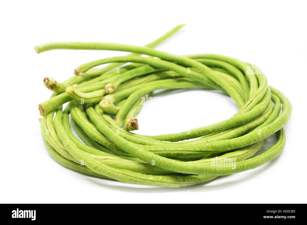 Bunch of fresh long bean isolated on white background Stock Photo - Alamy
