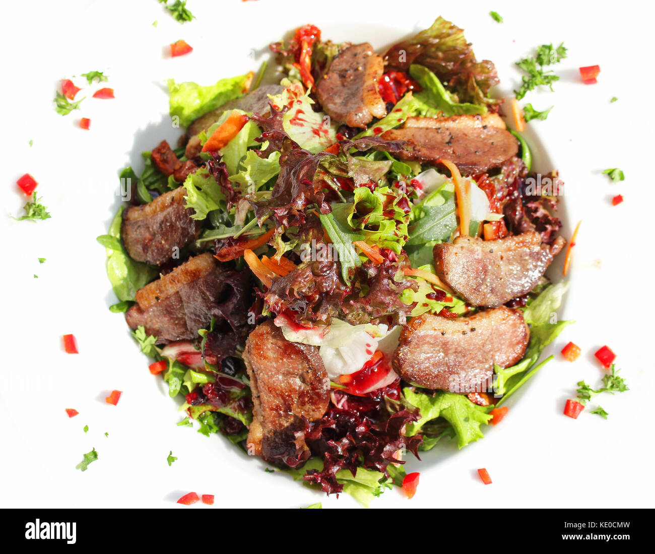 Fresh raw vegetable salad with grilled meat in a plate Stock Photo - Alamy