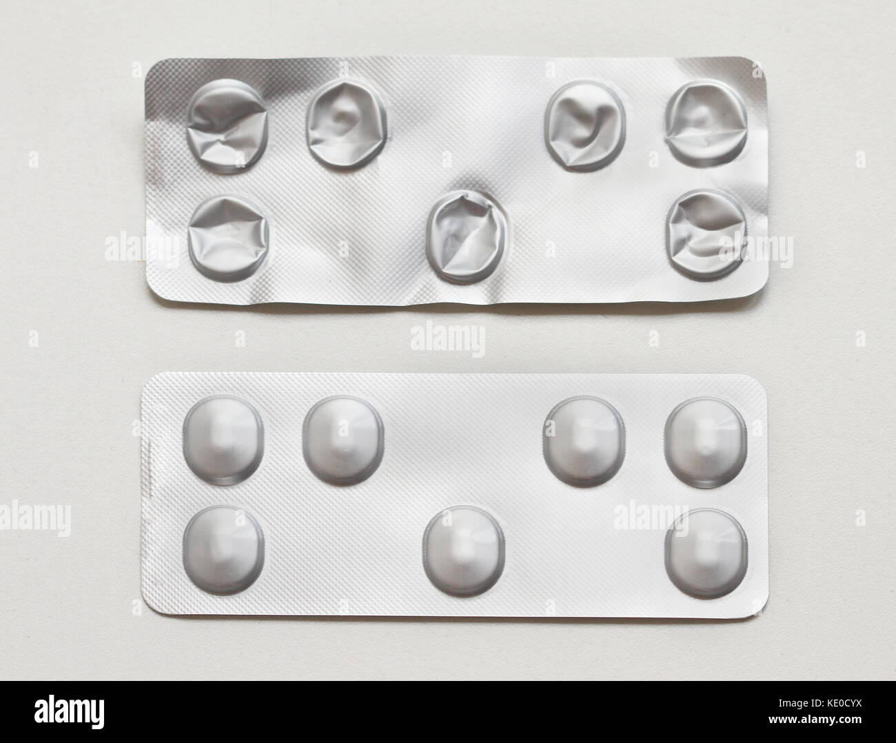 Two silver tablets blisters used and new Stock Photo - Alamy