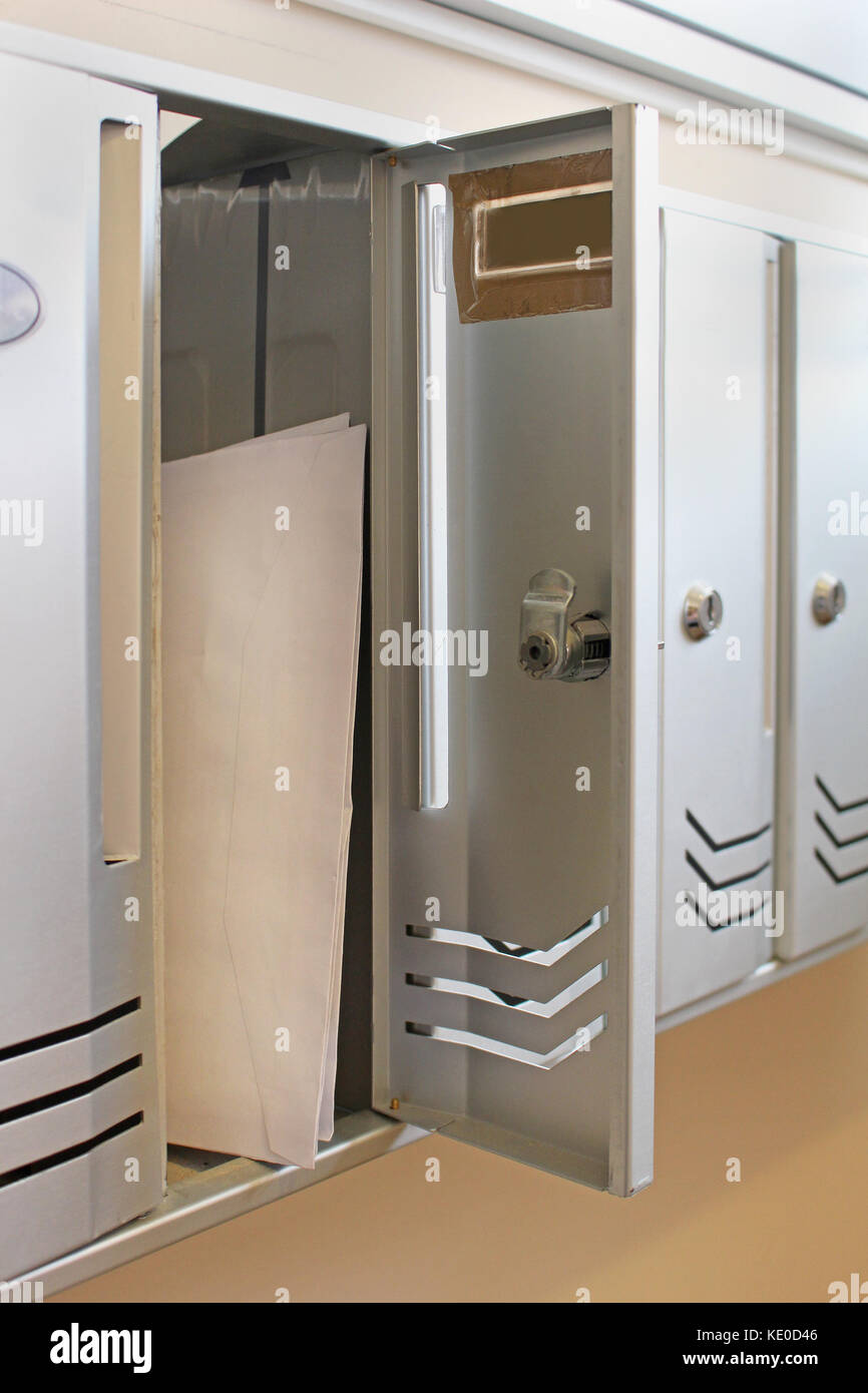 Unlocked open private mailbox with letters waiting inside for pick up ...