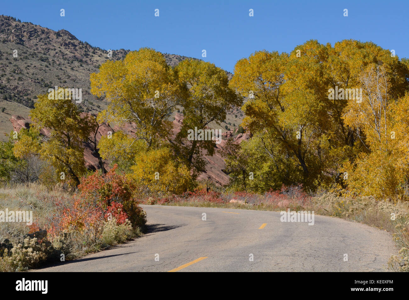 Entrance into Red Rocks Park Colorado as tree leaves start to turn ...