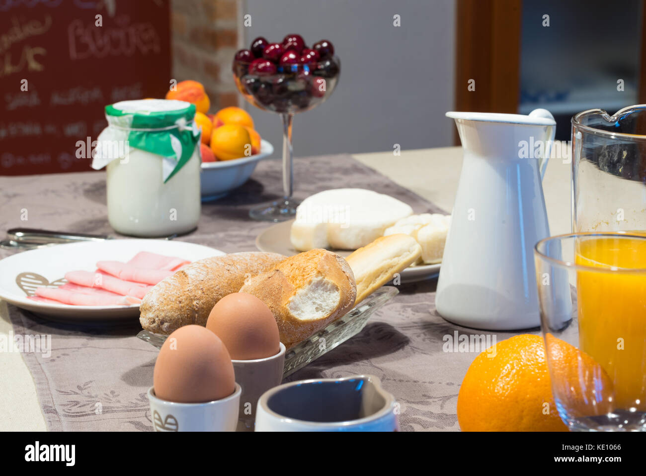 full breakfast table ready to be served in a hotel Stock Photo - Alamy