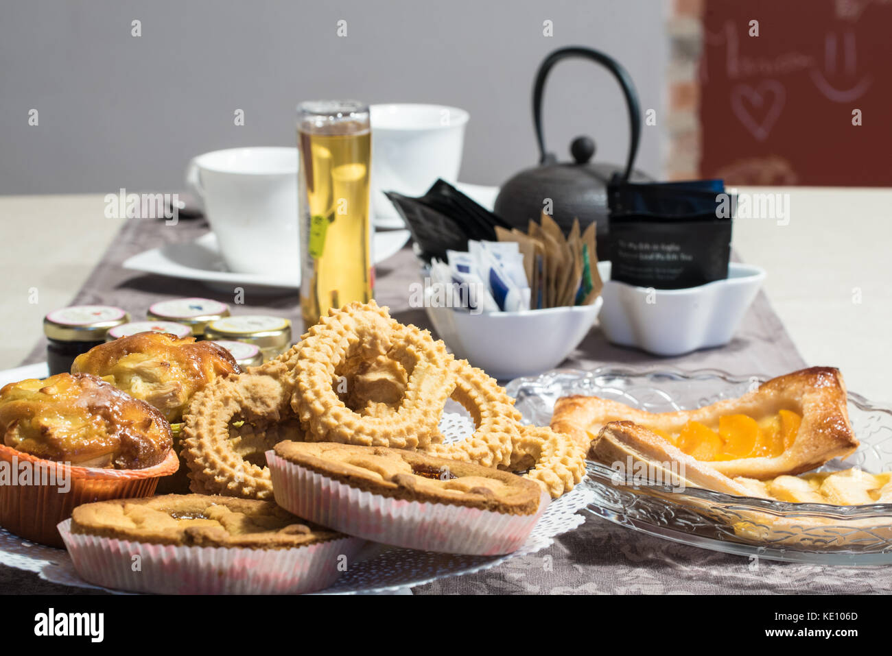 full breakfast table ready to be served in a hotel Stock Photo - Alamy