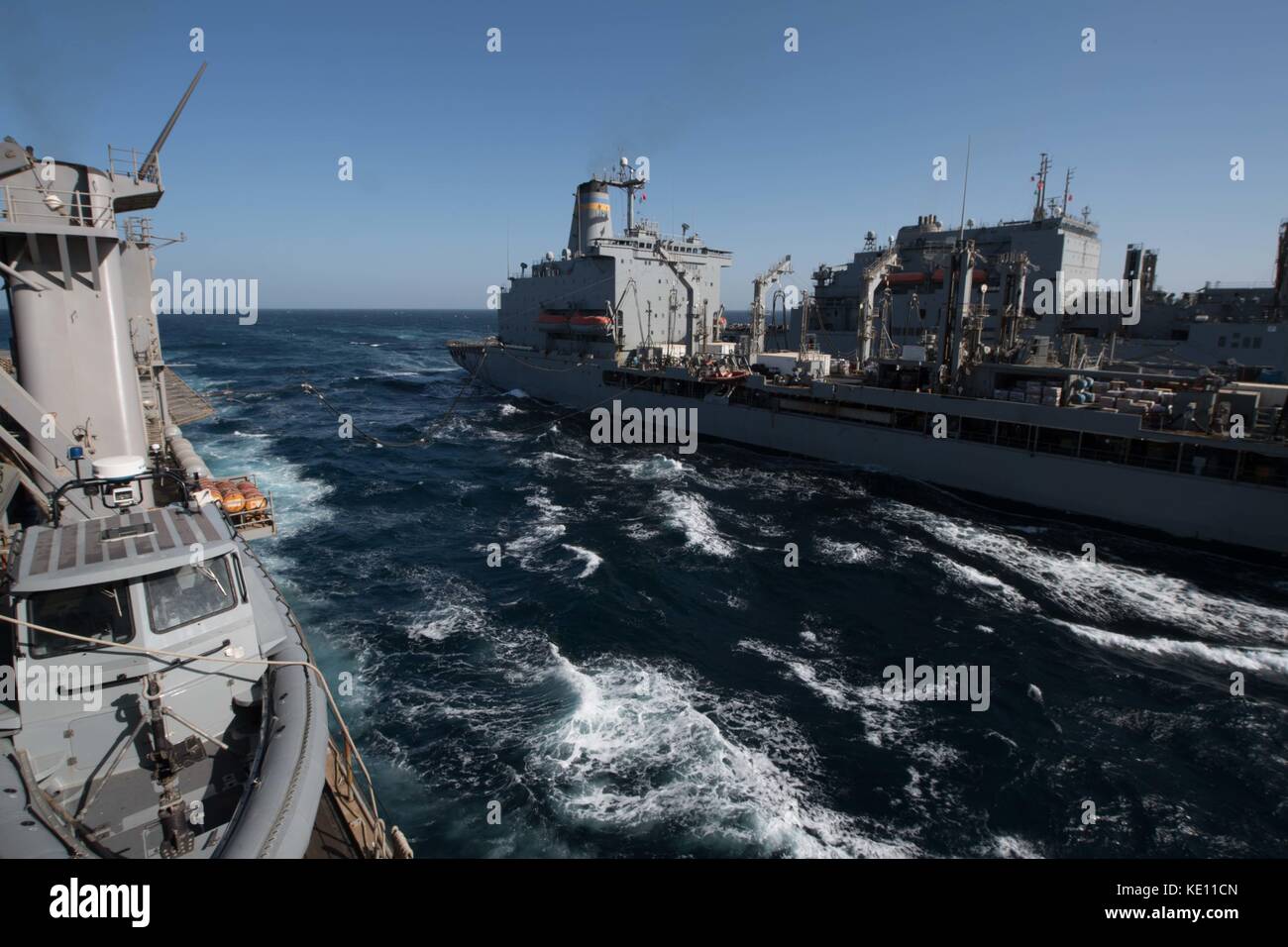 The amphibious dock landing ship USS Pearl Harbor (LSD 52) prepares to ...