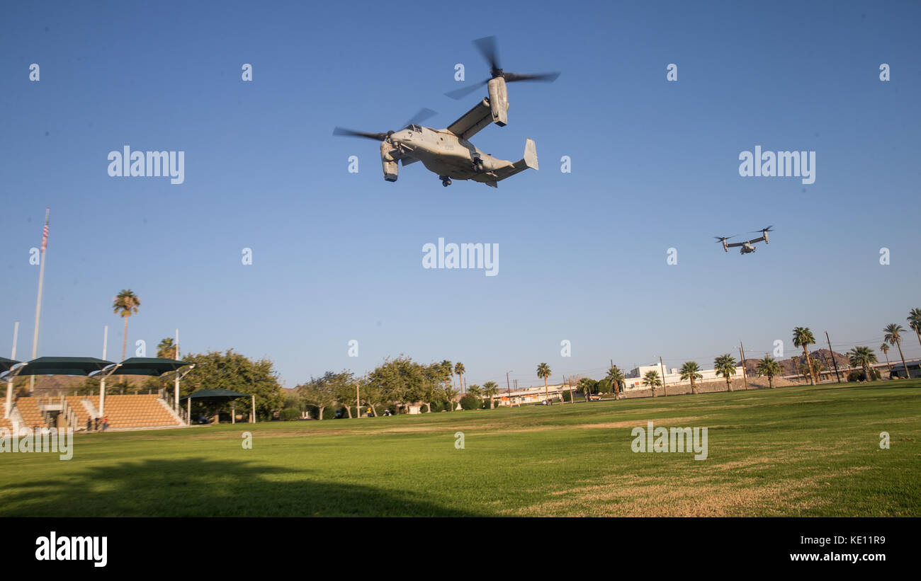 U.S. Marine Corps MV-22 Ospreys land in a field during Assault Support ...