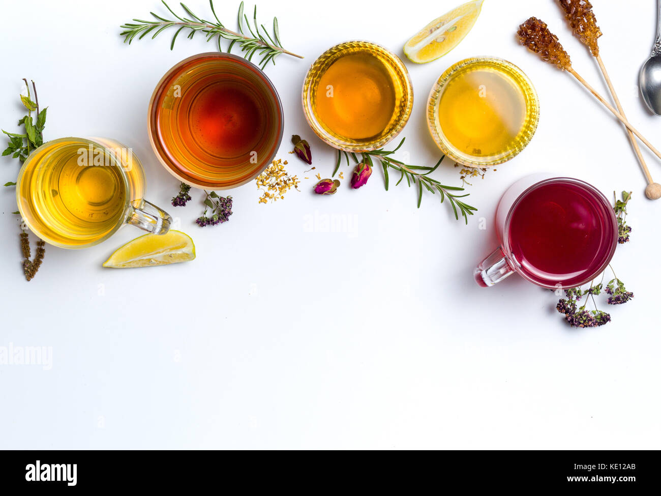 Herbal tea collection prepared in glasses on white background Stock ...