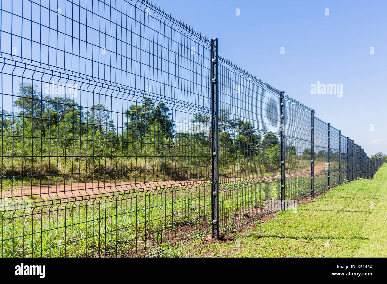 Boundary Fence steel erected on property in countryside landscape Stock ...