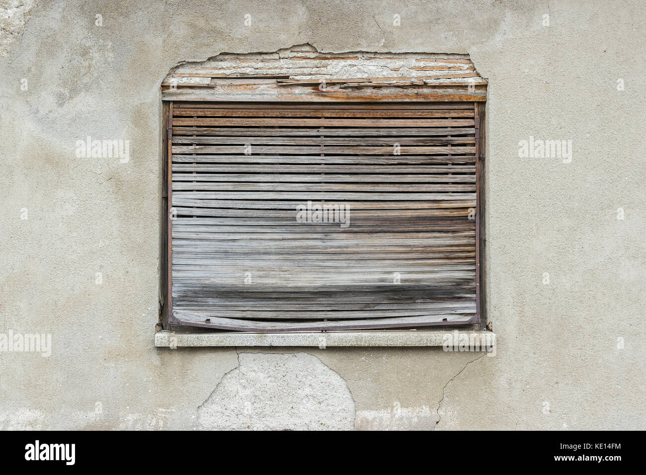 Old window covered with blinds on an old abandoned building Stock Photo ...