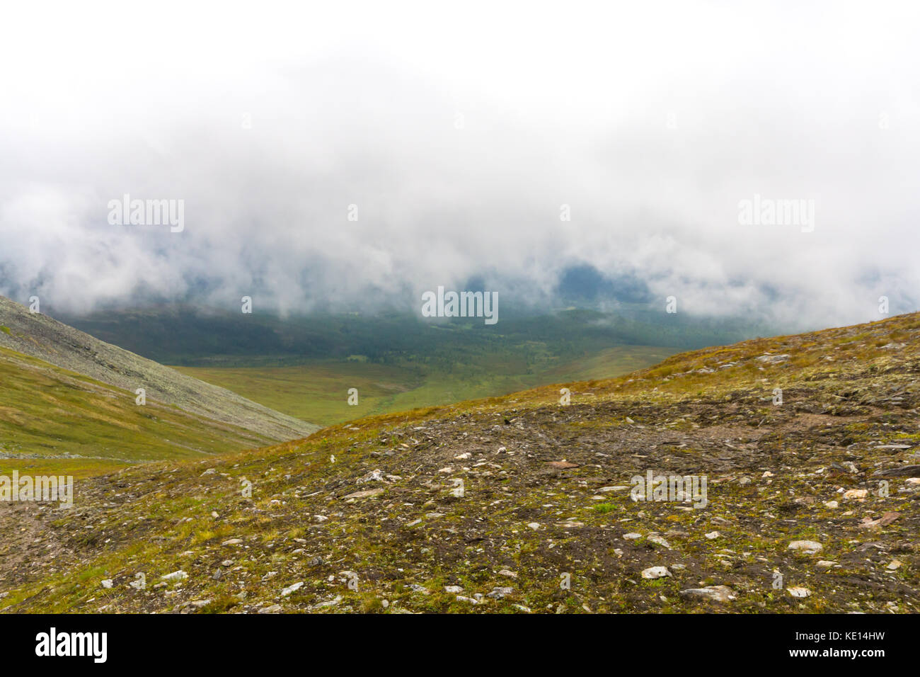 Clouds above the mountains and slope Stock Photo - Alamy