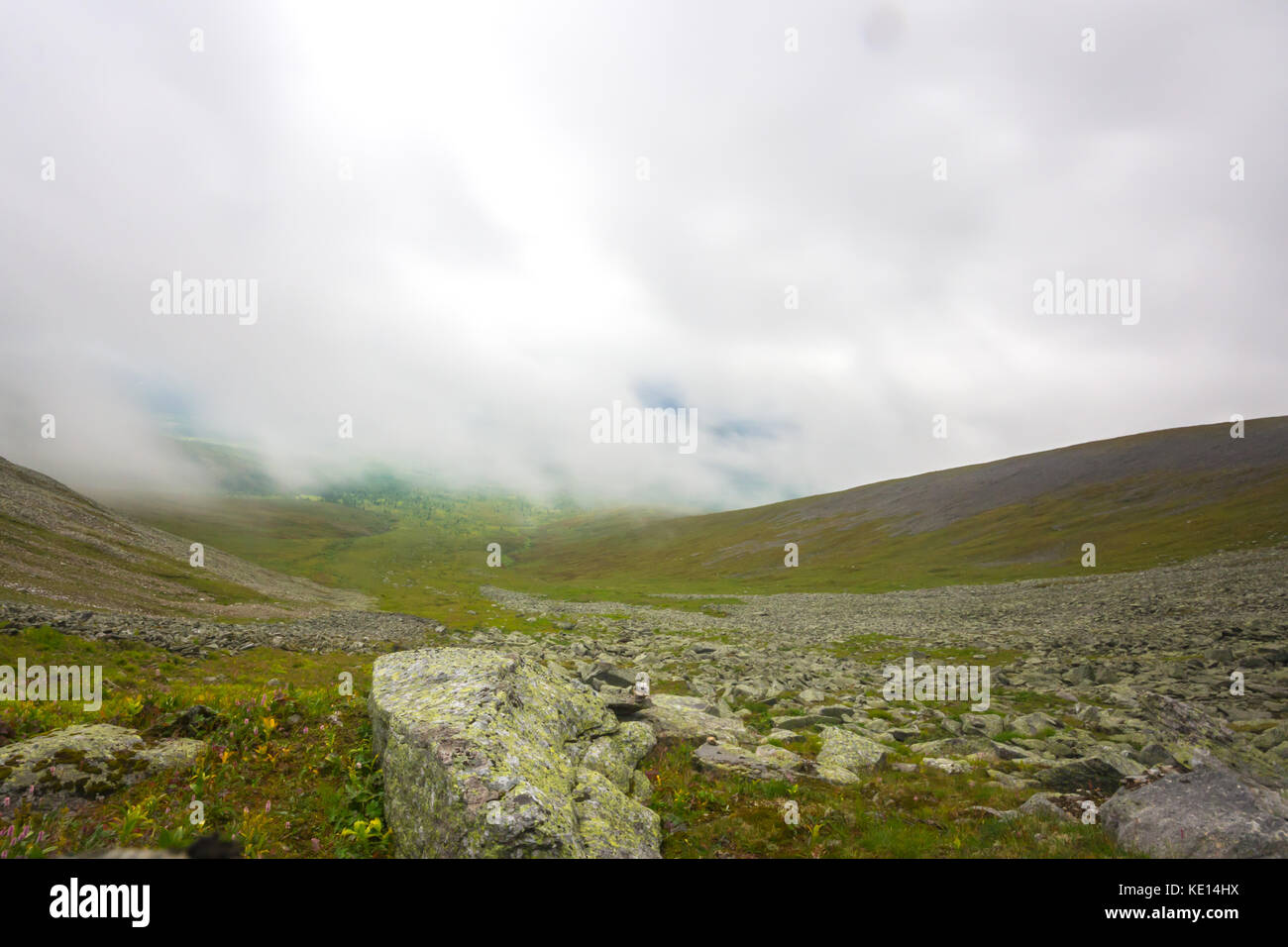 Clouds above the mountains and boulder Stock Photo - Alamy