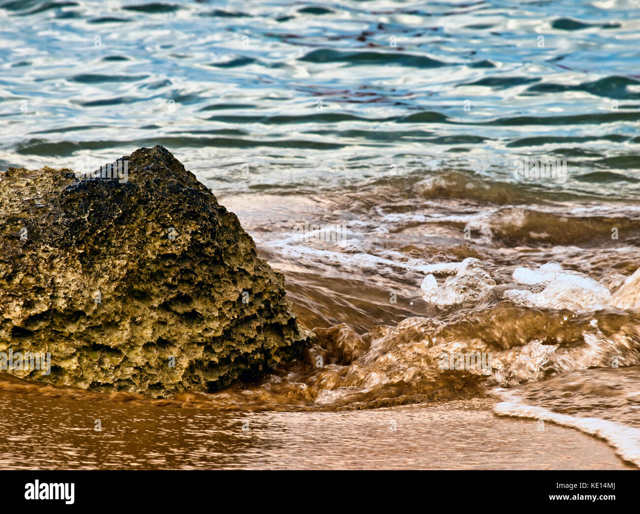 Rock on sandy beach hi-res stock photography and images - Alamy