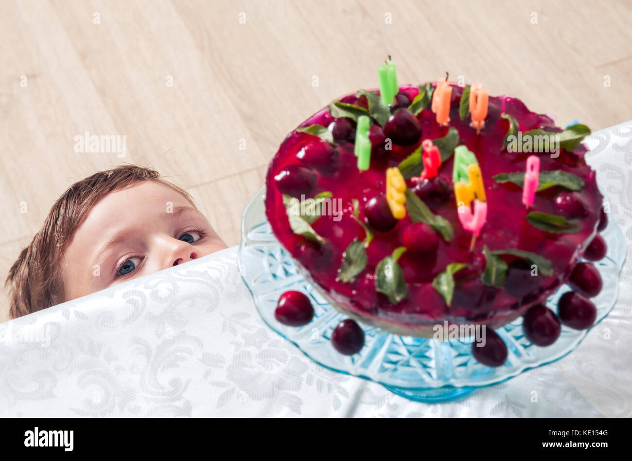 Little boy with the birthday cake Stock Photo - Alamy