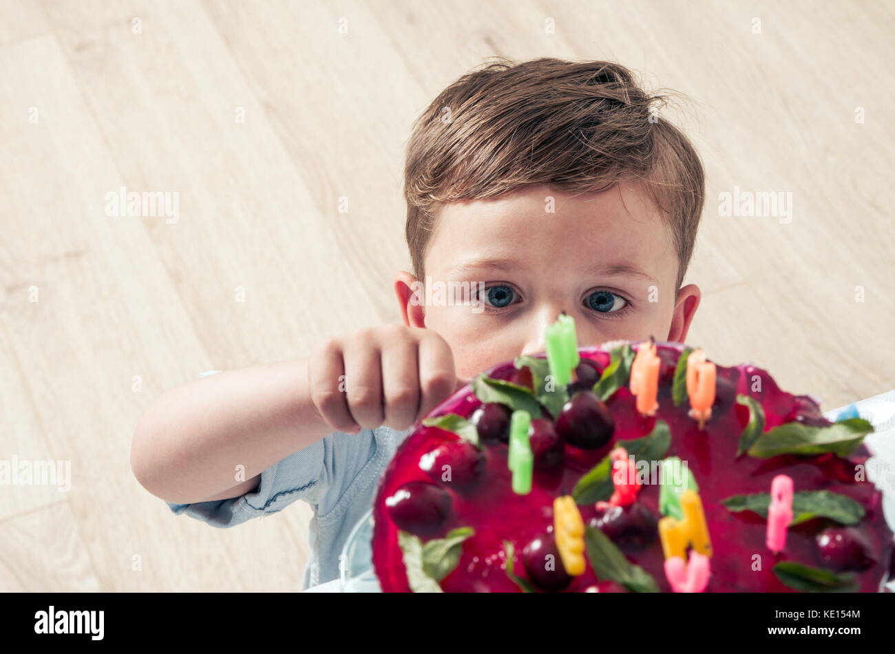 Little boy with the birthday cake Stock Photo - Alamy