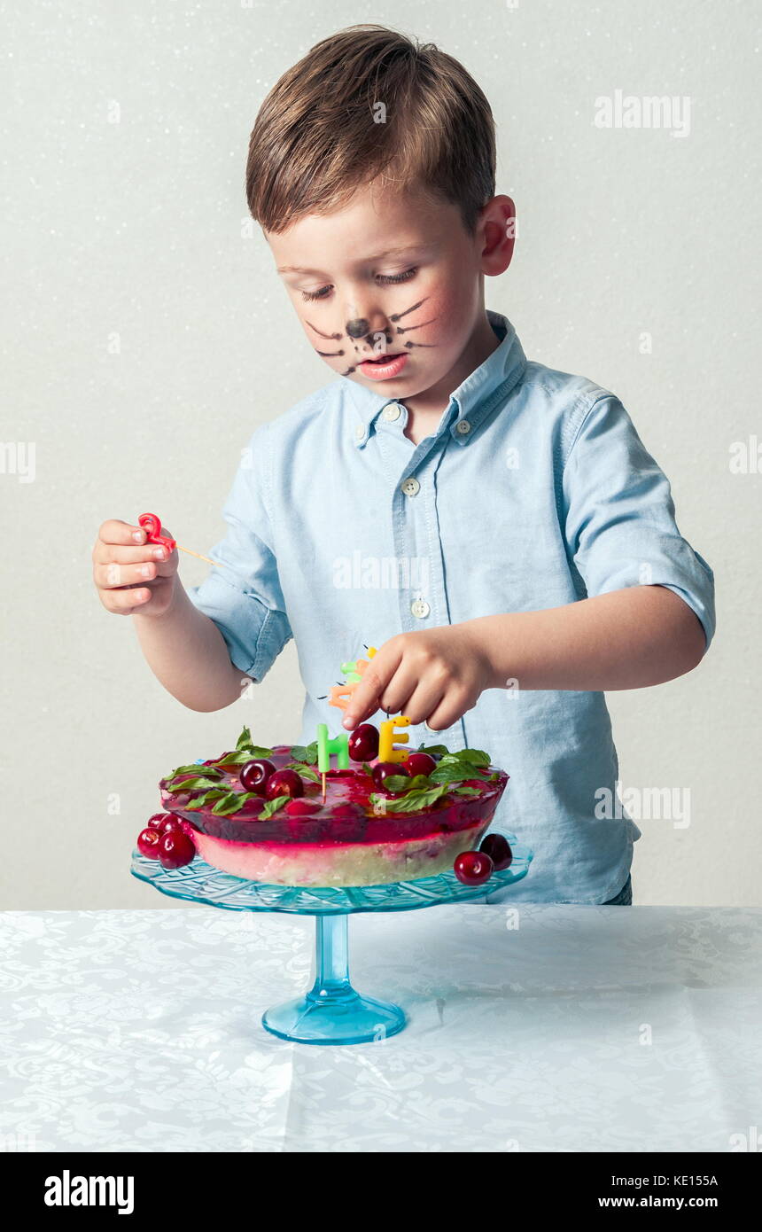 Little boy with the birthday cake Stock Photo - Alamy