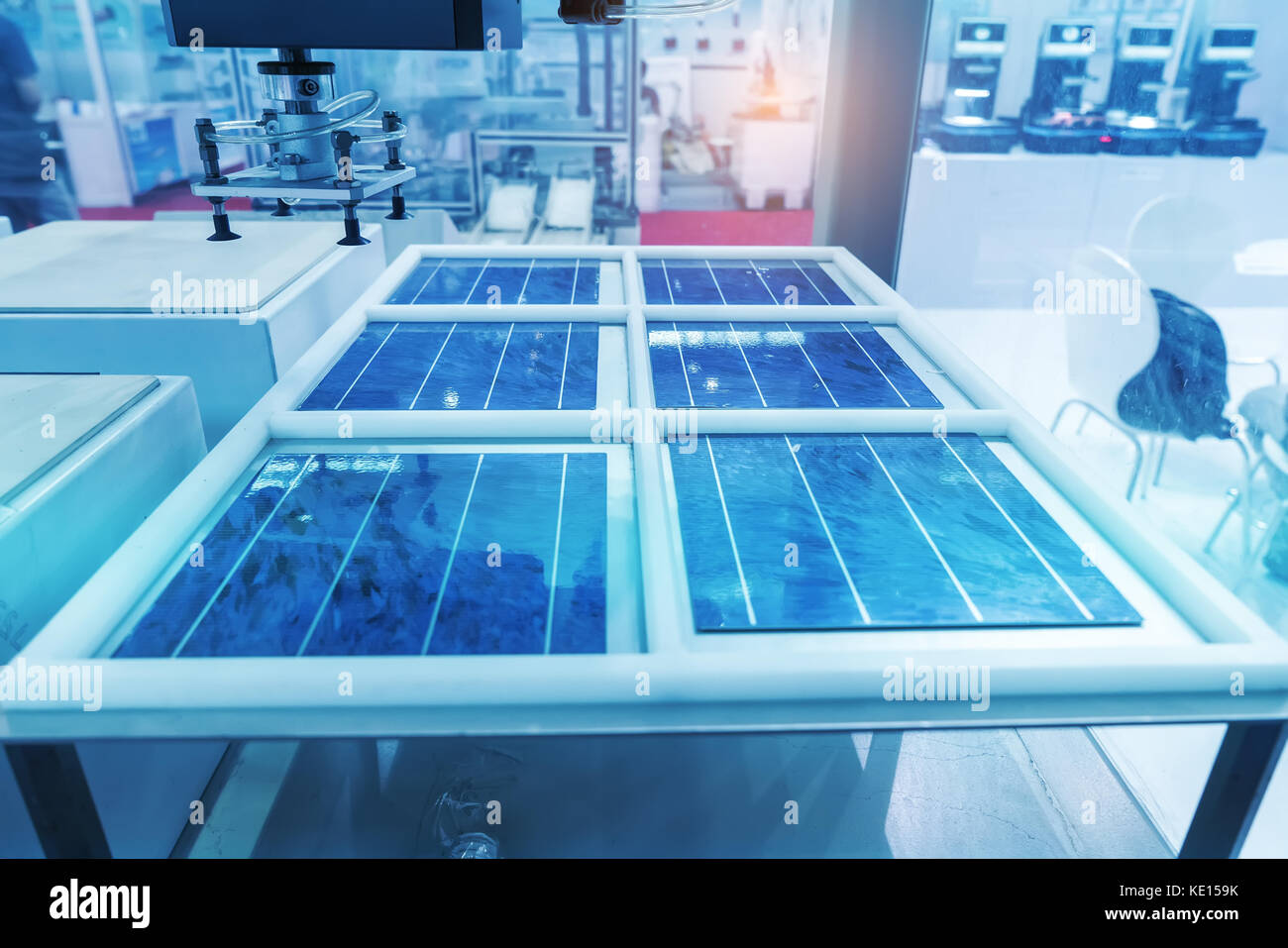 production of solar panels, Industrial robot working in factory ...