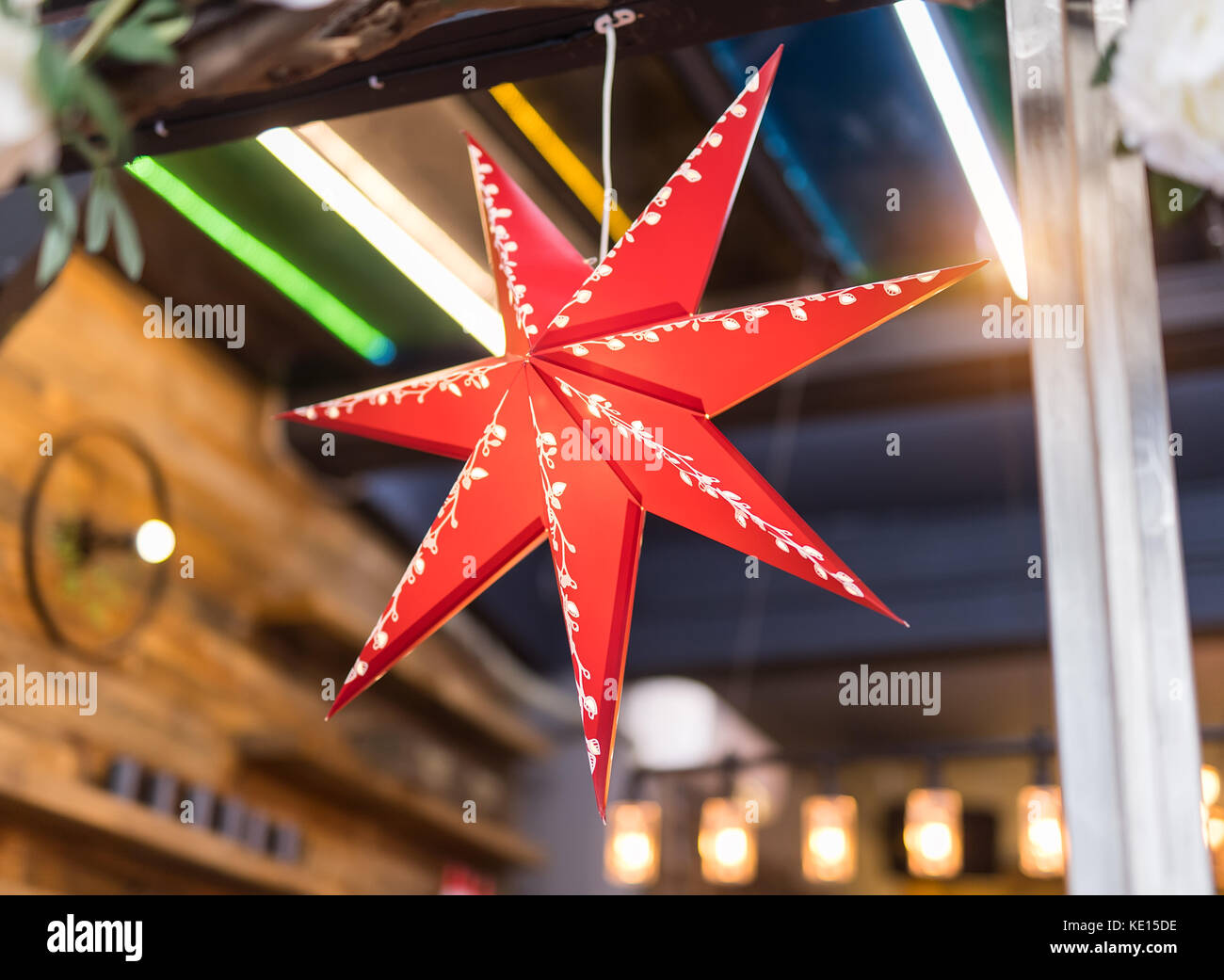 Paper stars hanging for holiday season Stock Photo - Alamy