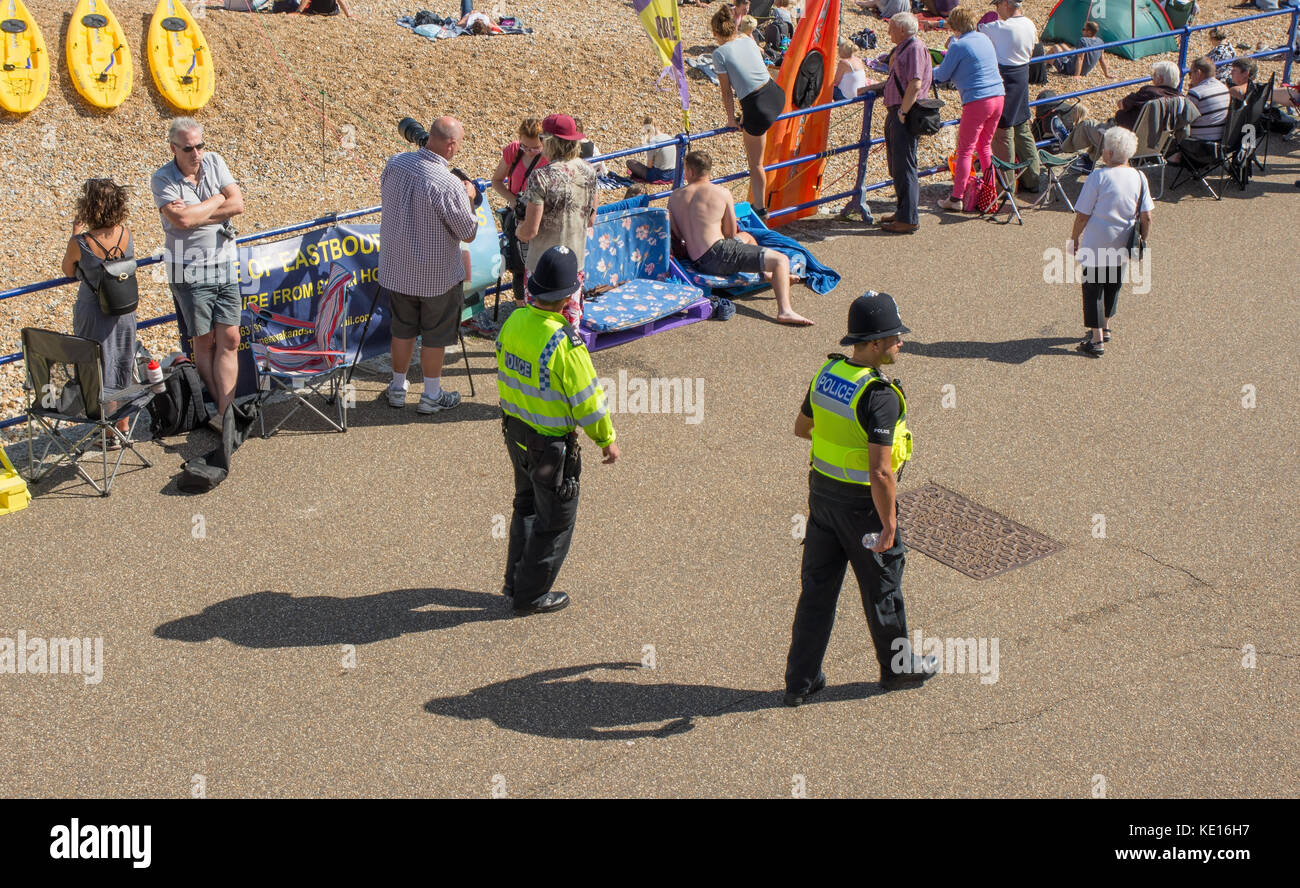 Two police officers patrolling the seafront promenade during the ...