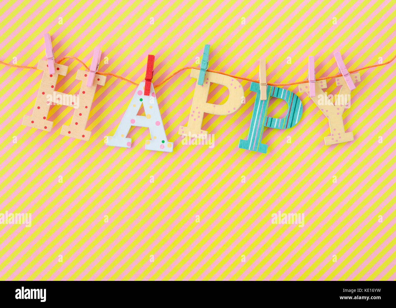 Colorful HAPPY banner on background with stripes Stock Photo - Alamy