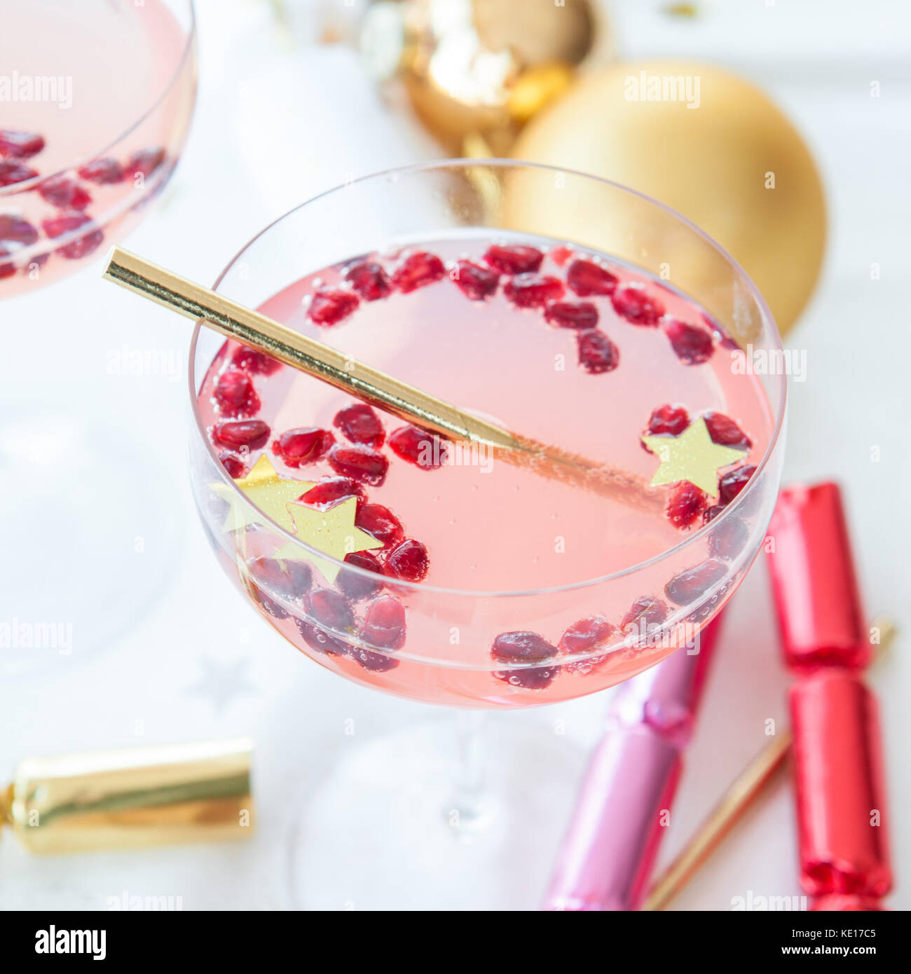 Pink bubbly cocktail and festive christmas decorations Stock Photo - Alamy