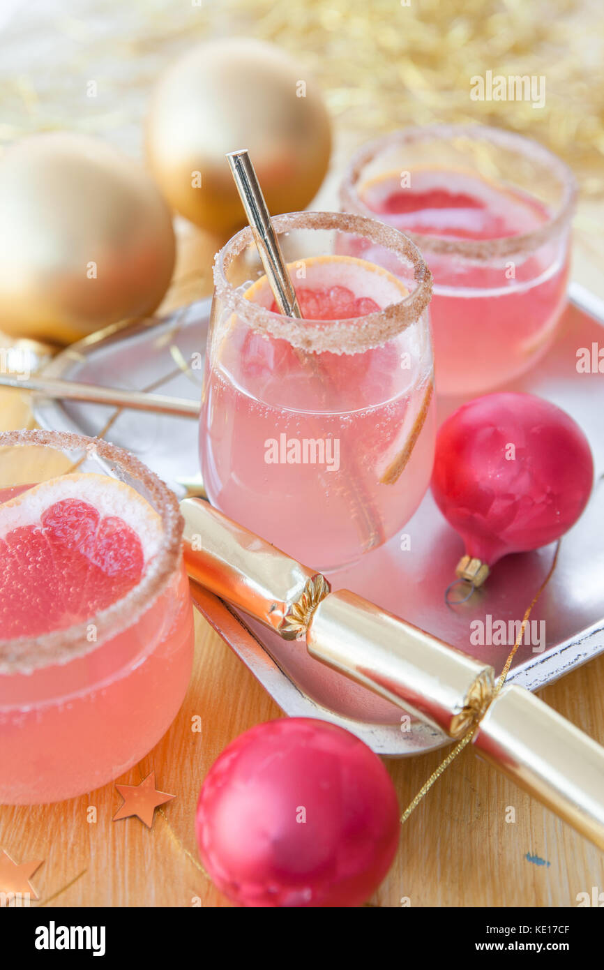 Pink bubbly cocktail and festive christmas decorations Stock Photo - Alamy