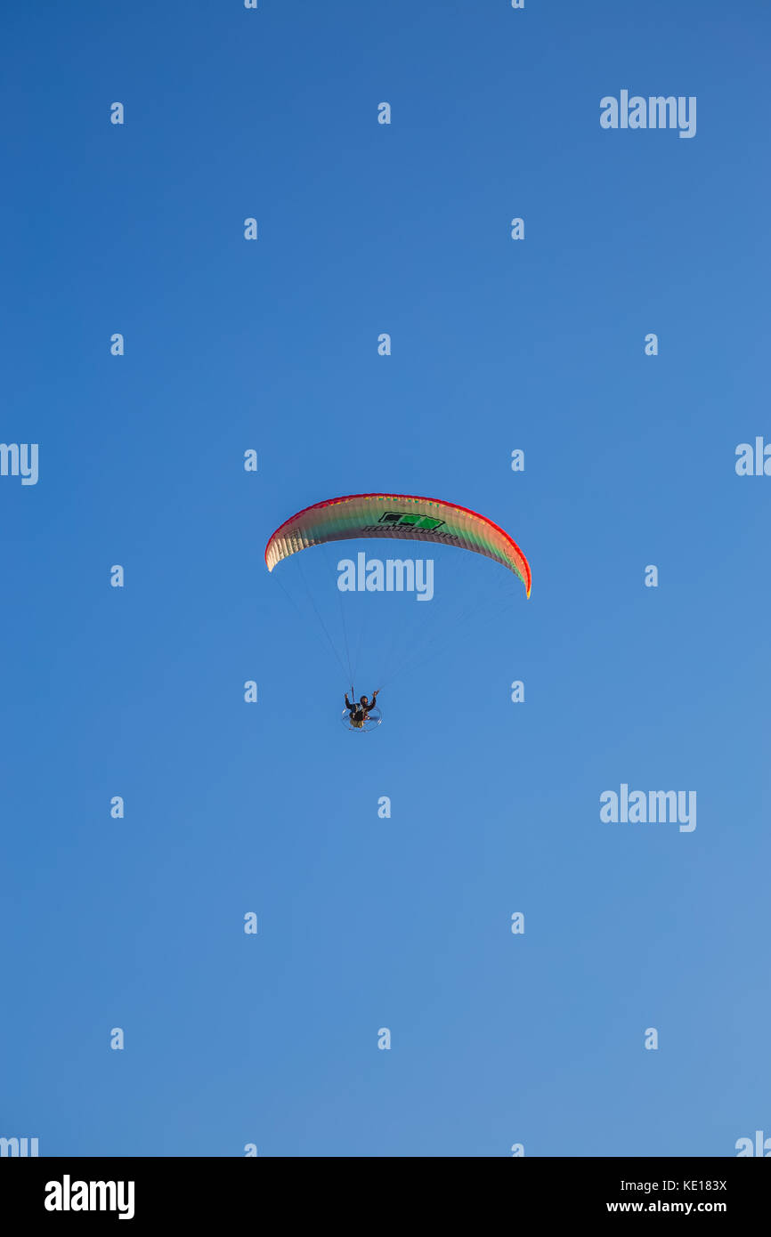 Paramotor flying during a performance Stock Photo - Alamy