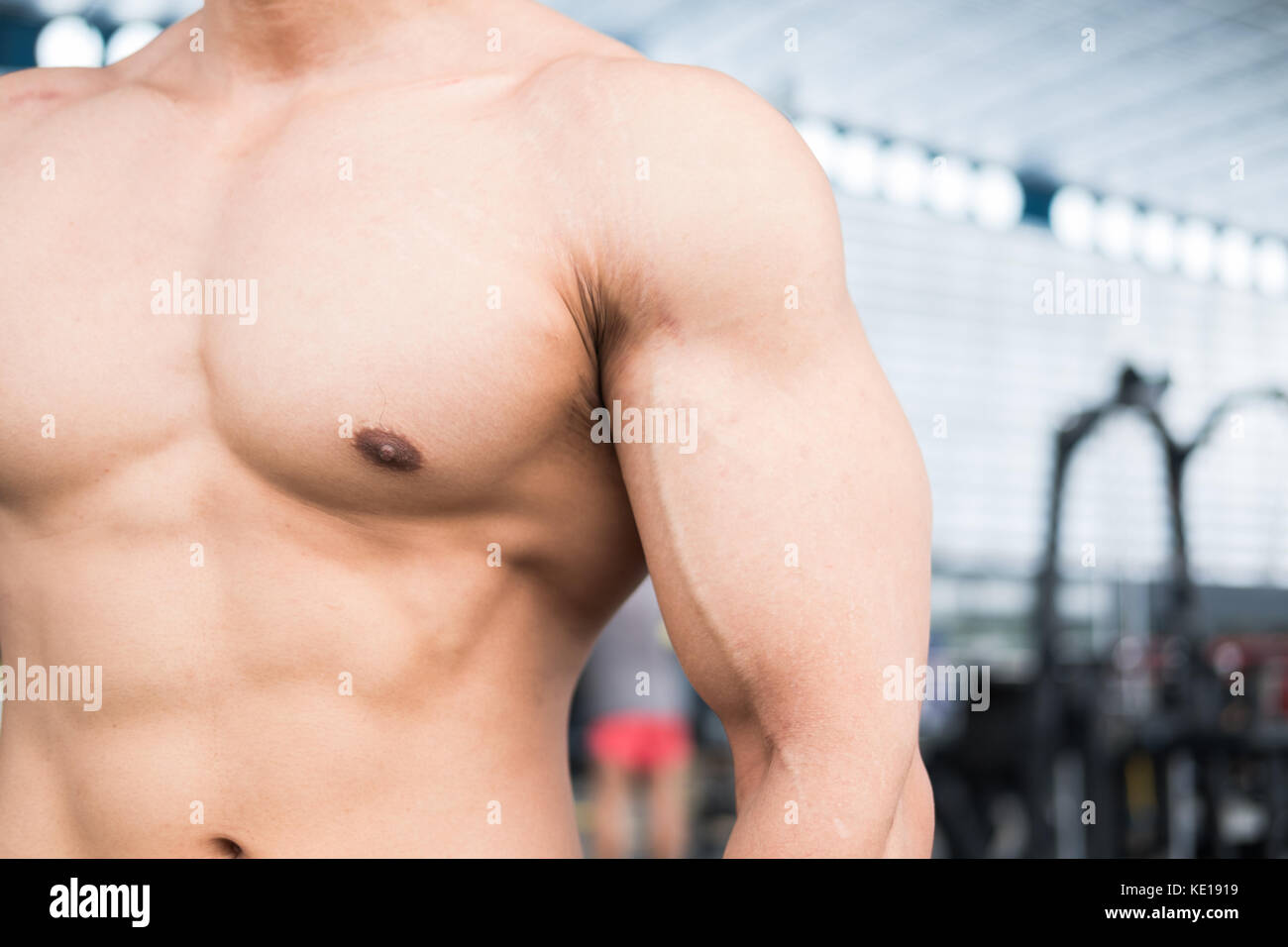 young man athlete prepare for training in gym. bodybuilder male working ...