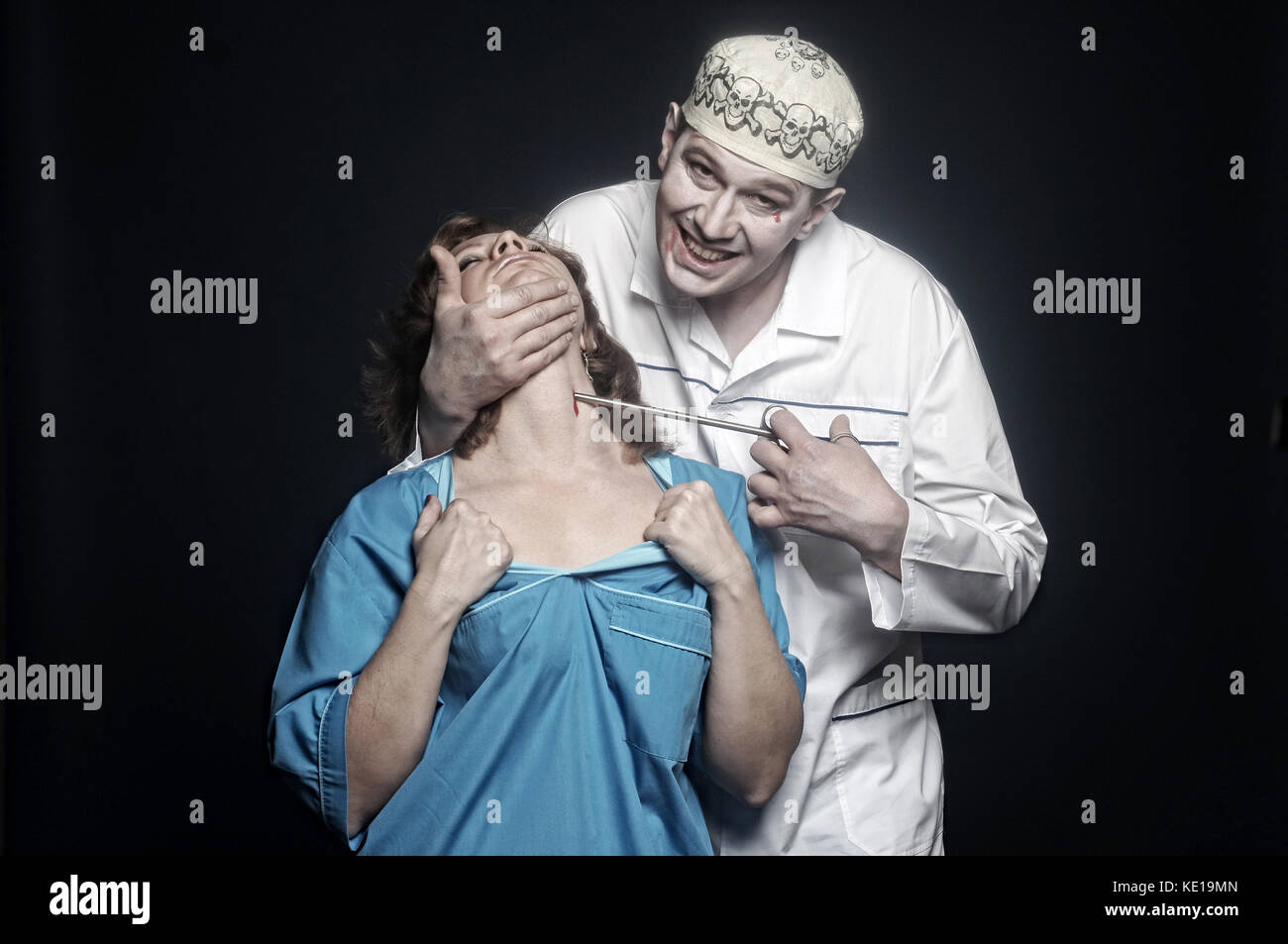 crazy evil doctor Dentist in a white coat.isolated studio portrait ...