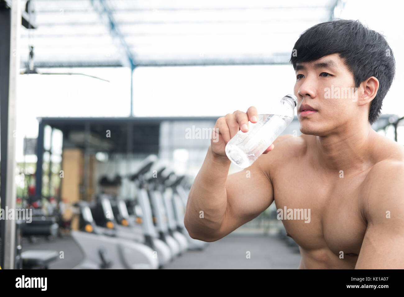 Asian man drinking from water hi-res stock photography and images - Alamy
