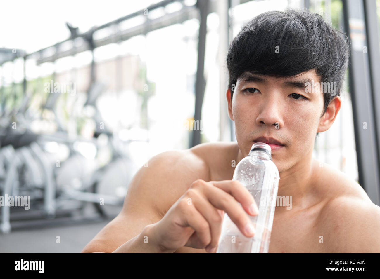Asian man drinking from water hi-res stock photography and images - Alamy