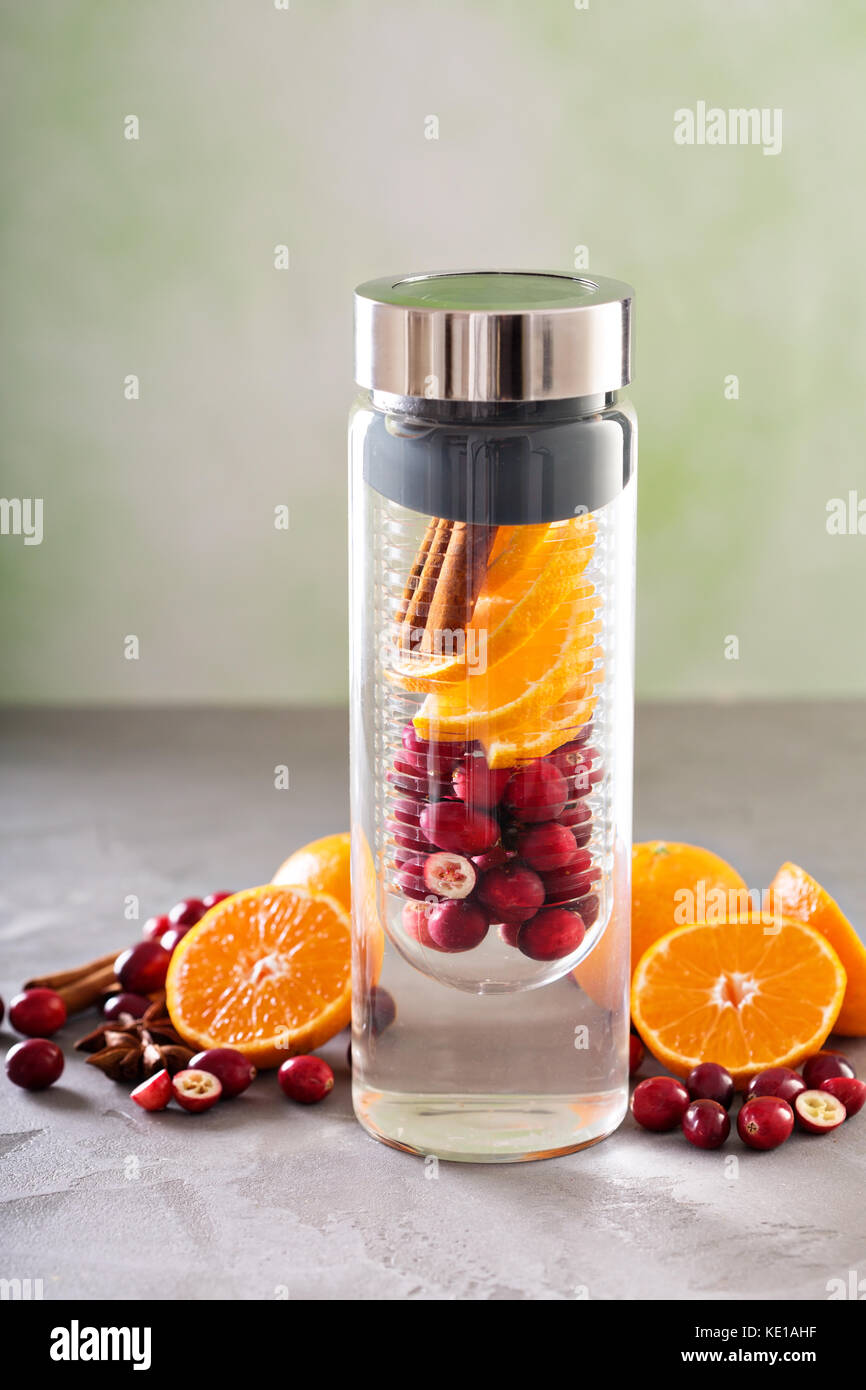Winter or fall refreshing infused water with cranberry and orange Stock ...