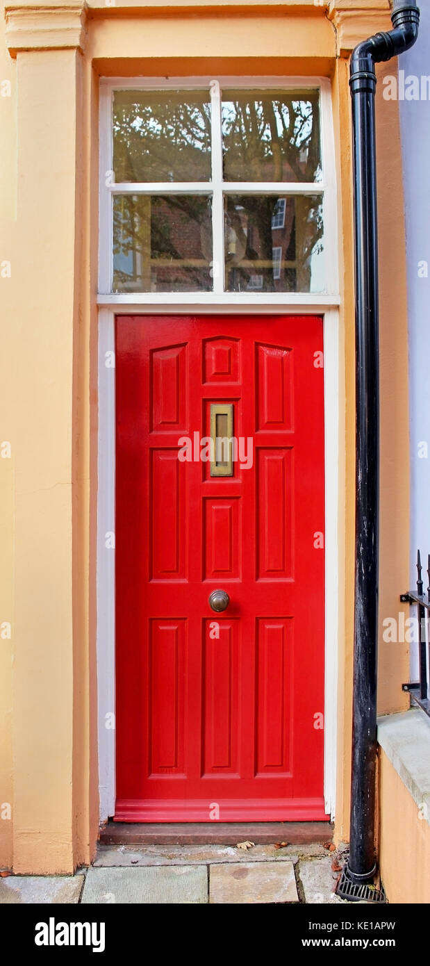 Retro red entrance door on residential house Stock Photo - Alamy