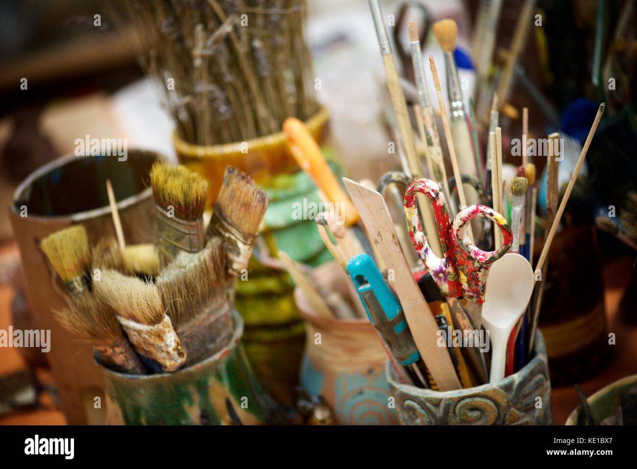 Group of brushes and tools n an artist's workshop Stock Photo - Alamy