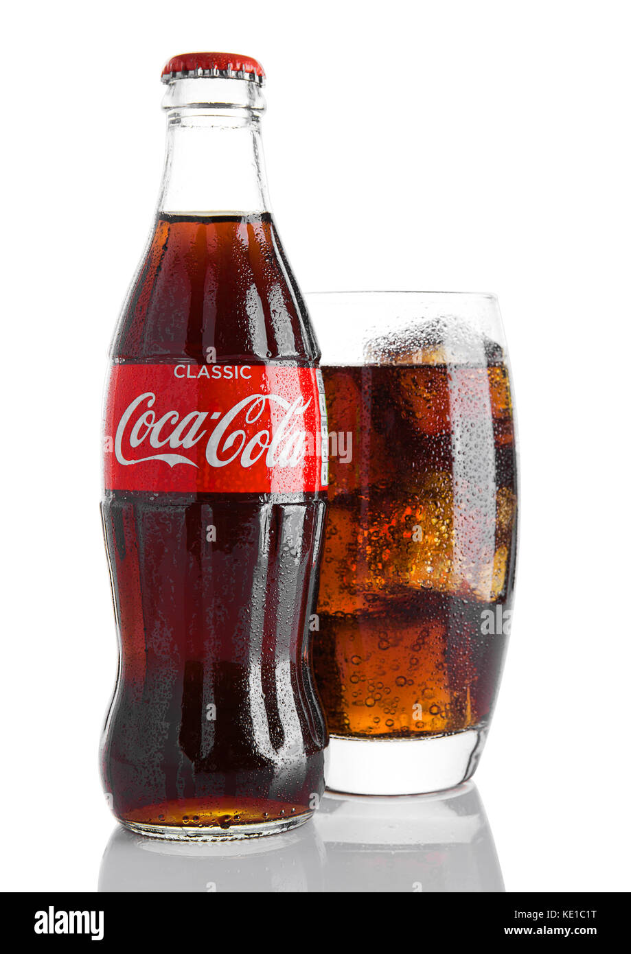 LONDON,UK - MARCH 30, 2017 : Bottle and glass with ice cubes of Coca ...