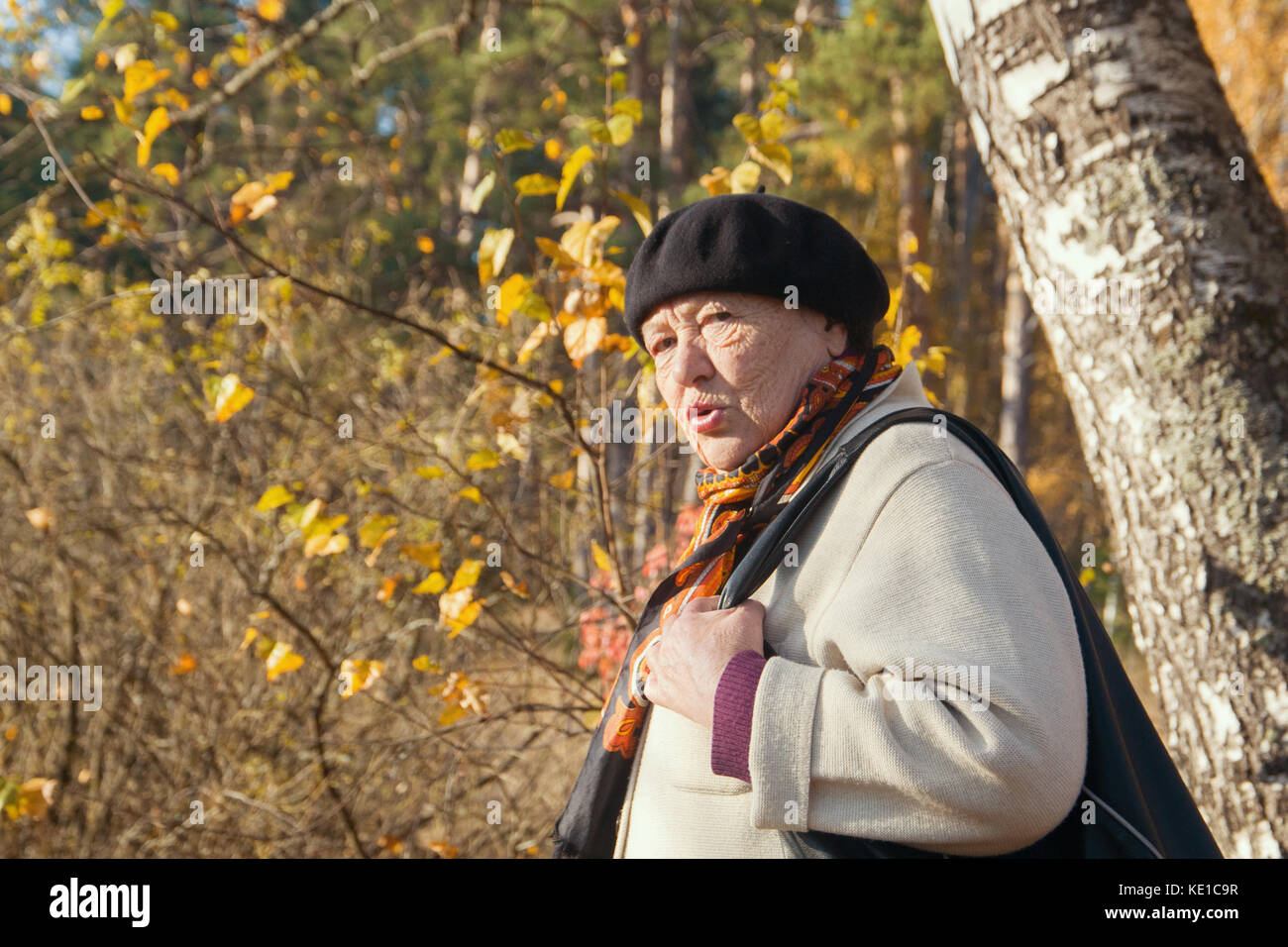 Angry old woman feels disgust in autumn park Stock Photo - Alamy