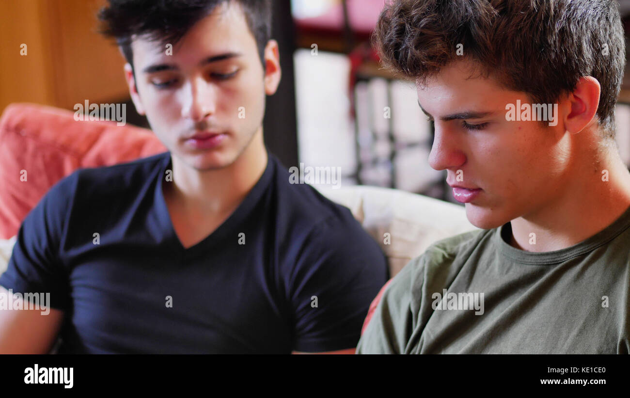 Two young men talking and chatting Stock Photo - Alamy Two young men talking and chatting Stock Photo - Alamy