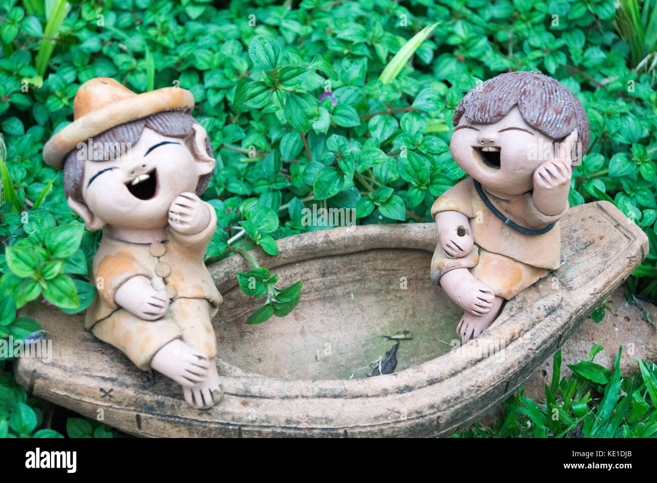 ton figures in a garden Stock Photo - Alamy