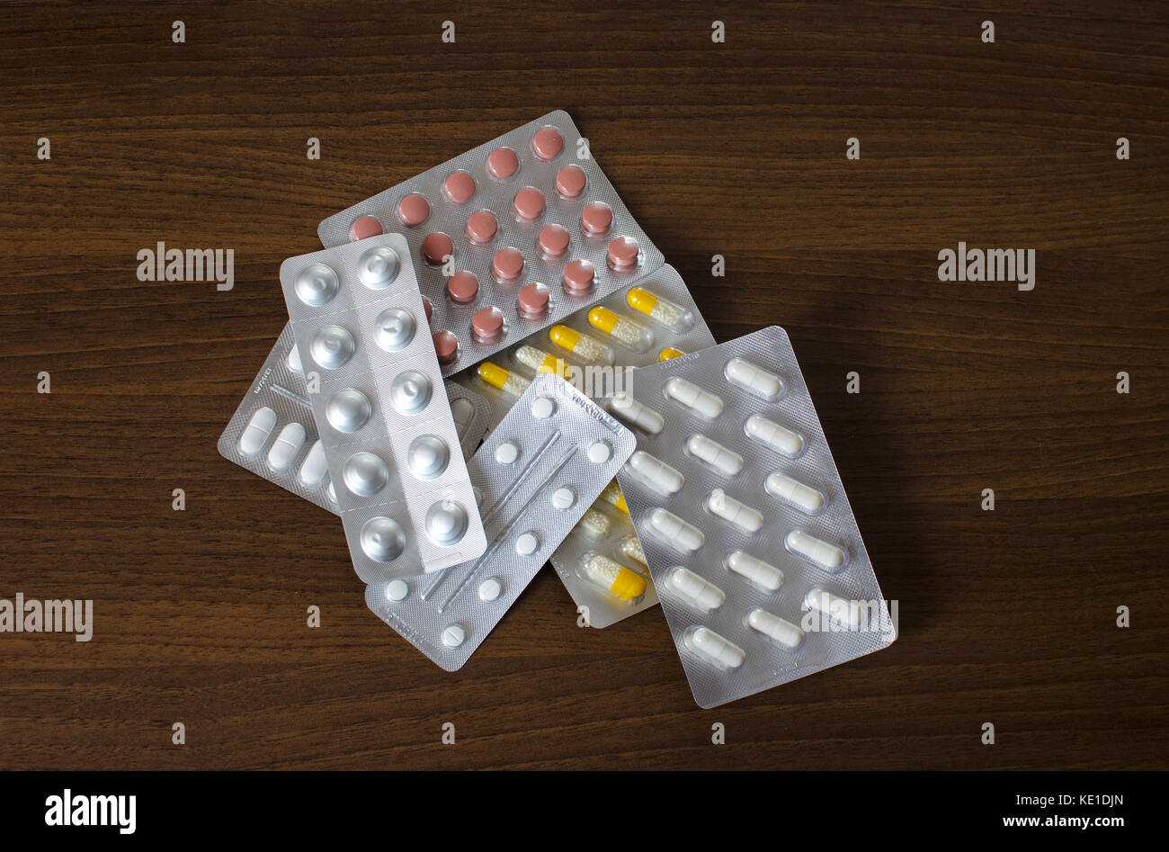 View of the tray of drugs lying in a pile on a wooden background Stock ...