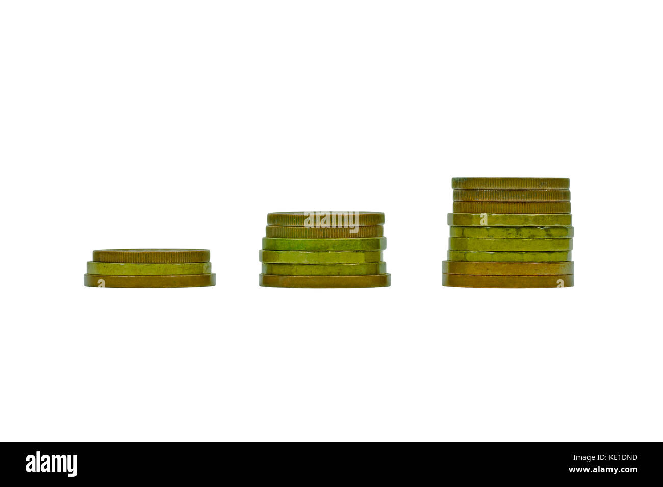 Close-up view of three stacks of coins arranged in a growing chart ...